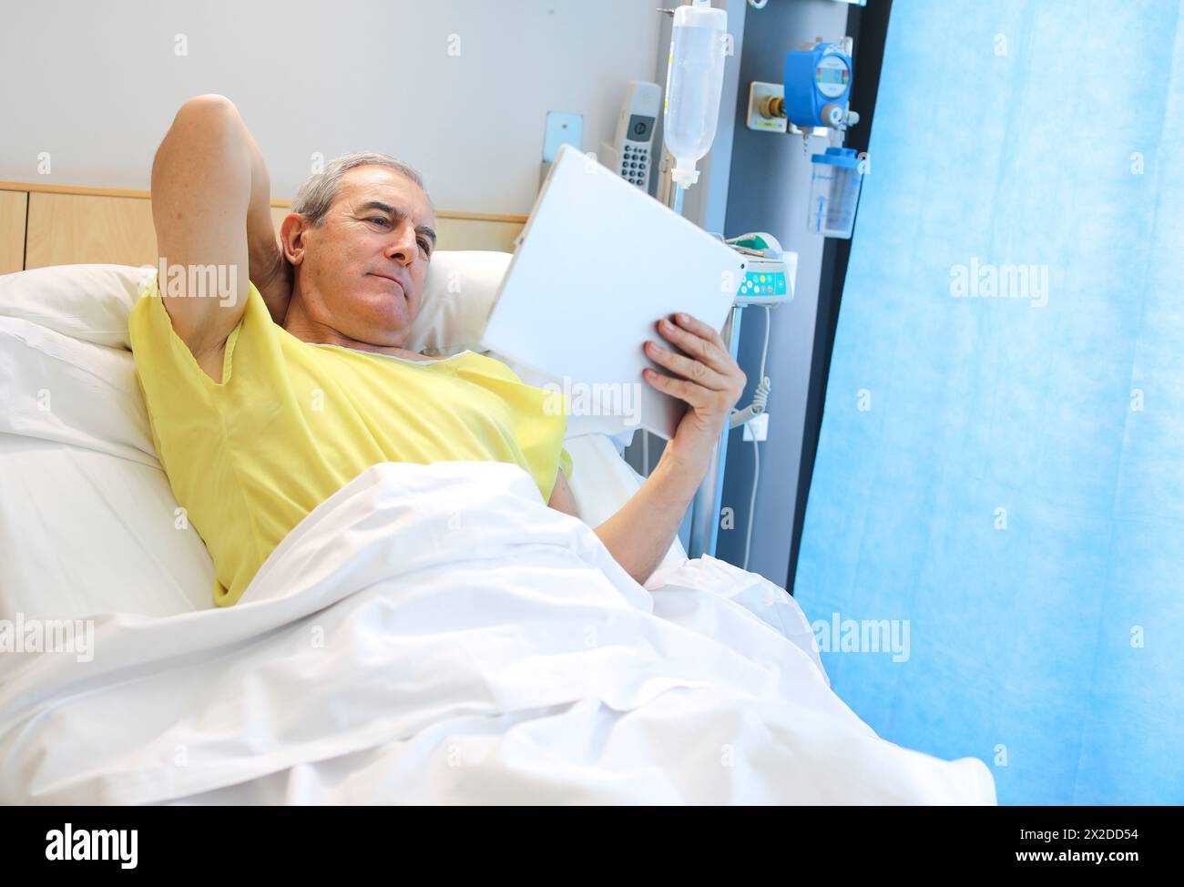 Patient in hospital room with tablet, Hospital Stock Photo - Alamy