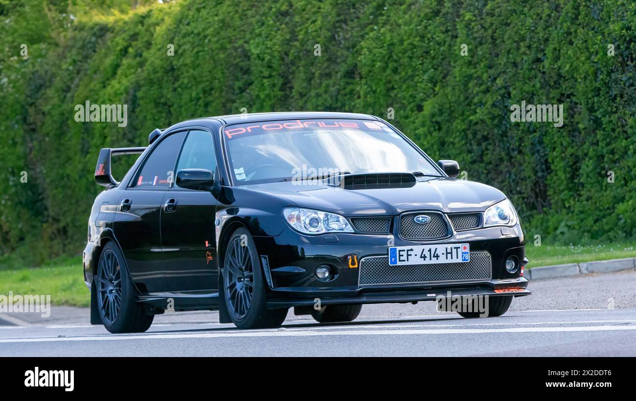 Bicester,UK- Apr 21st 2024: Subaru classic car driving on a British ...