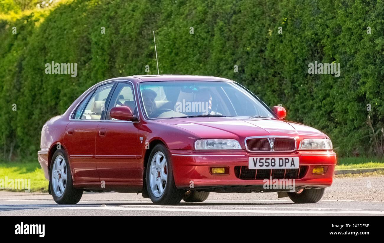 Bicester,UK- Apr 21st2024: 1999 red Rover 620 classic car driving on a ...