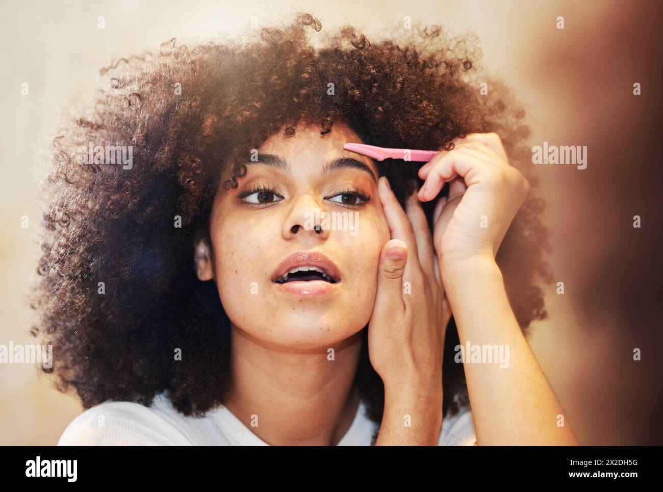 Woman, skincare and bathroom for beauty of eyebrows with facial blade ...