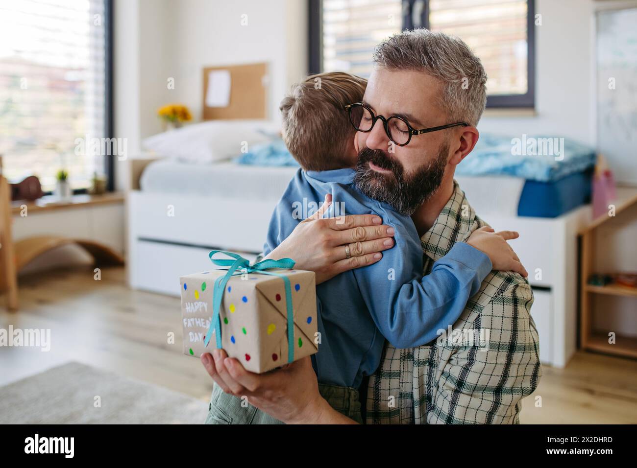 Dad get a handmade gift from little son, present wrapped in diy ...