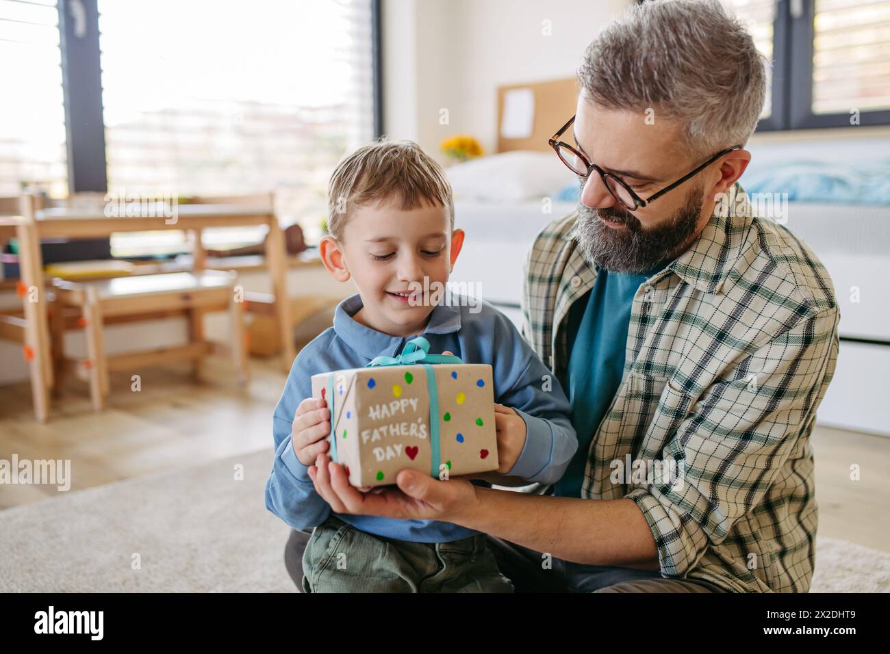Dad get a handmade gift from little son, present wrapped in diy ...