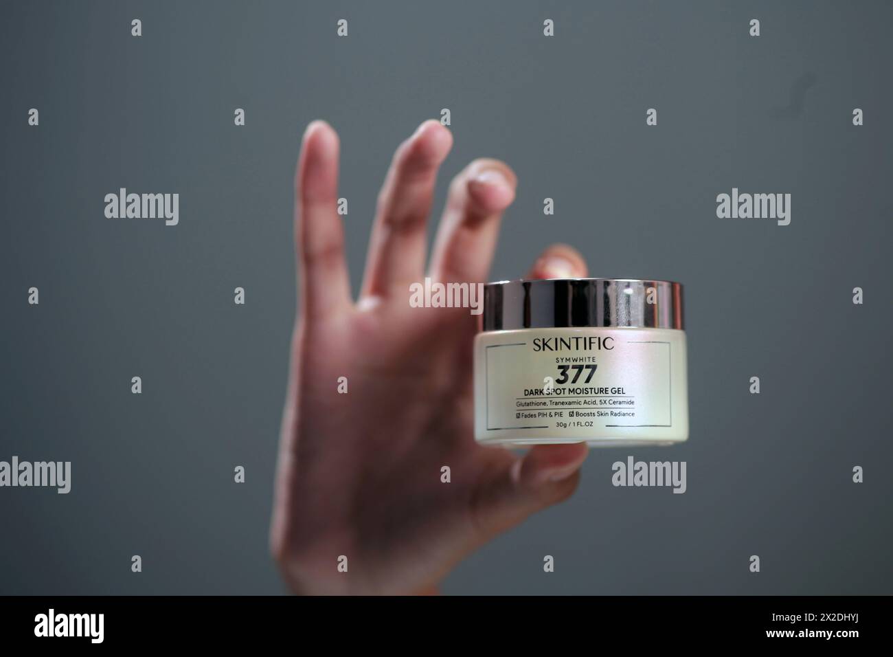 hand holding beauty product Stock Photo - Alamy