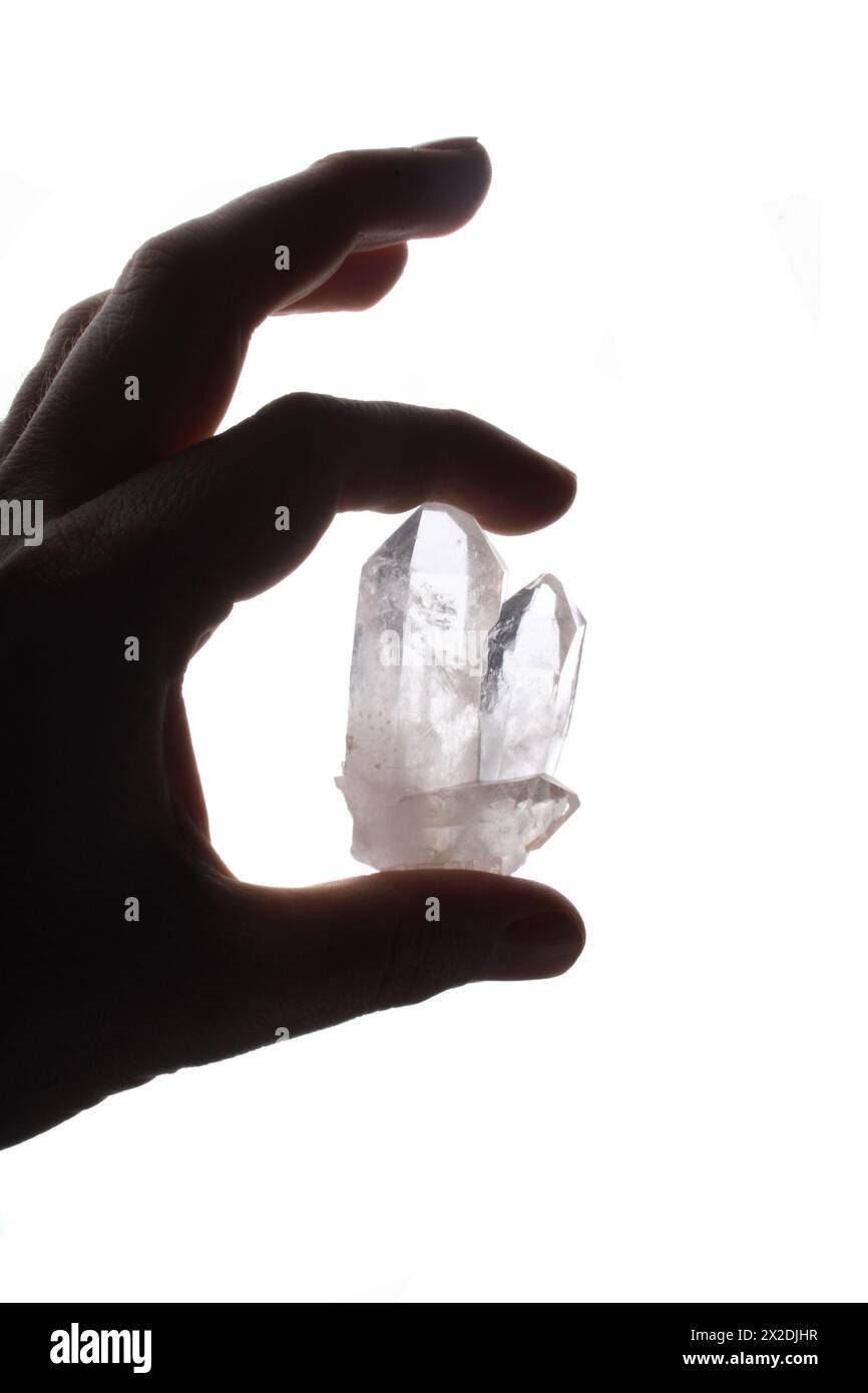 crystal in the hand isolated on the white background Stock Photo - Alamy
