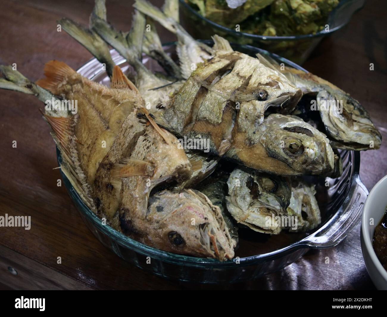 fried fish on a plate Stock Photo - Alamy
