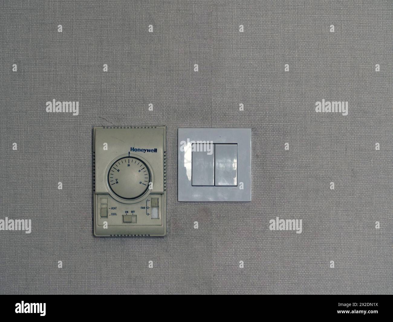 AC remote stuck to the wall Stock Photo - Alamy