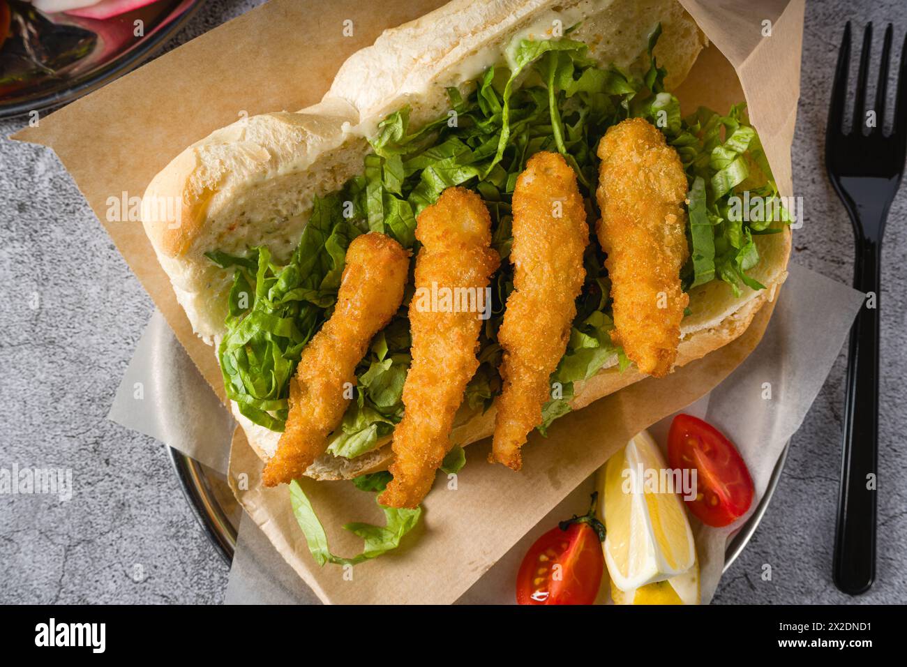 Deep fried shrimp in bread with greens on the side. Shrimp sandwich ...