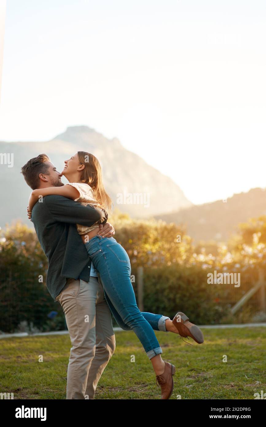 Happy couple, hug and laughing in park for marriage anniversary or ...