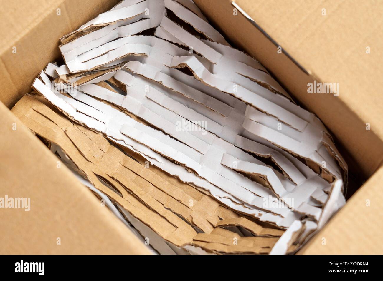 Paper cut filler in cardboard box for parcel shipments of fragile ...