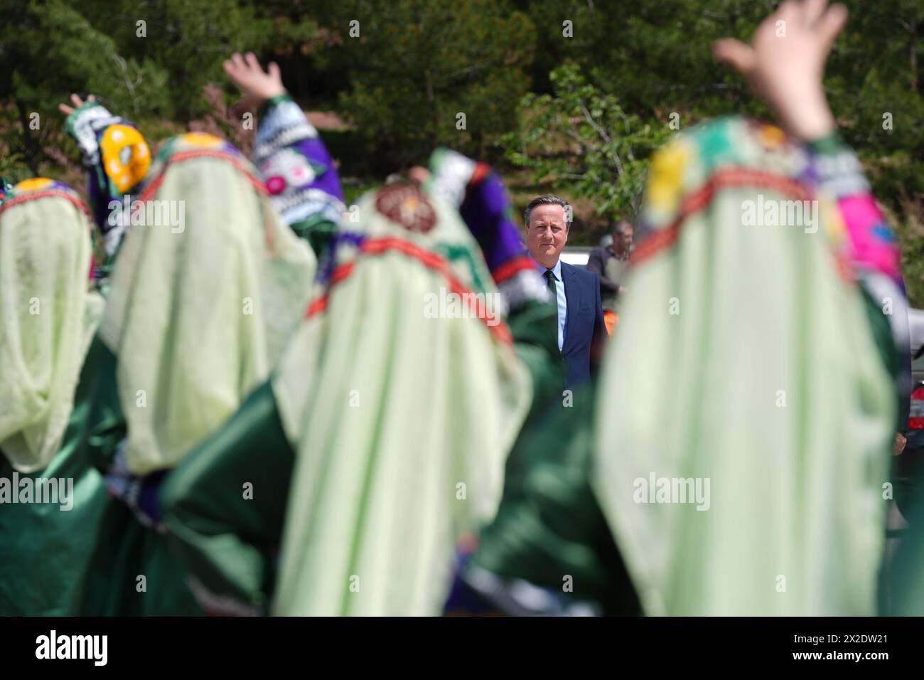 Foreign Secretary Lord David Cameron watches dancers as he arrives at ...