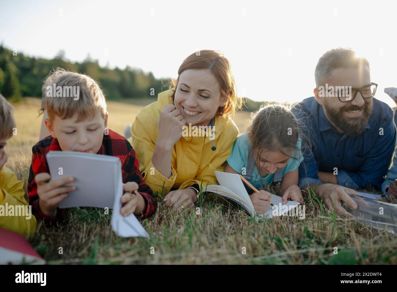 Young students learning about nature, forest ecosystem during biology ...