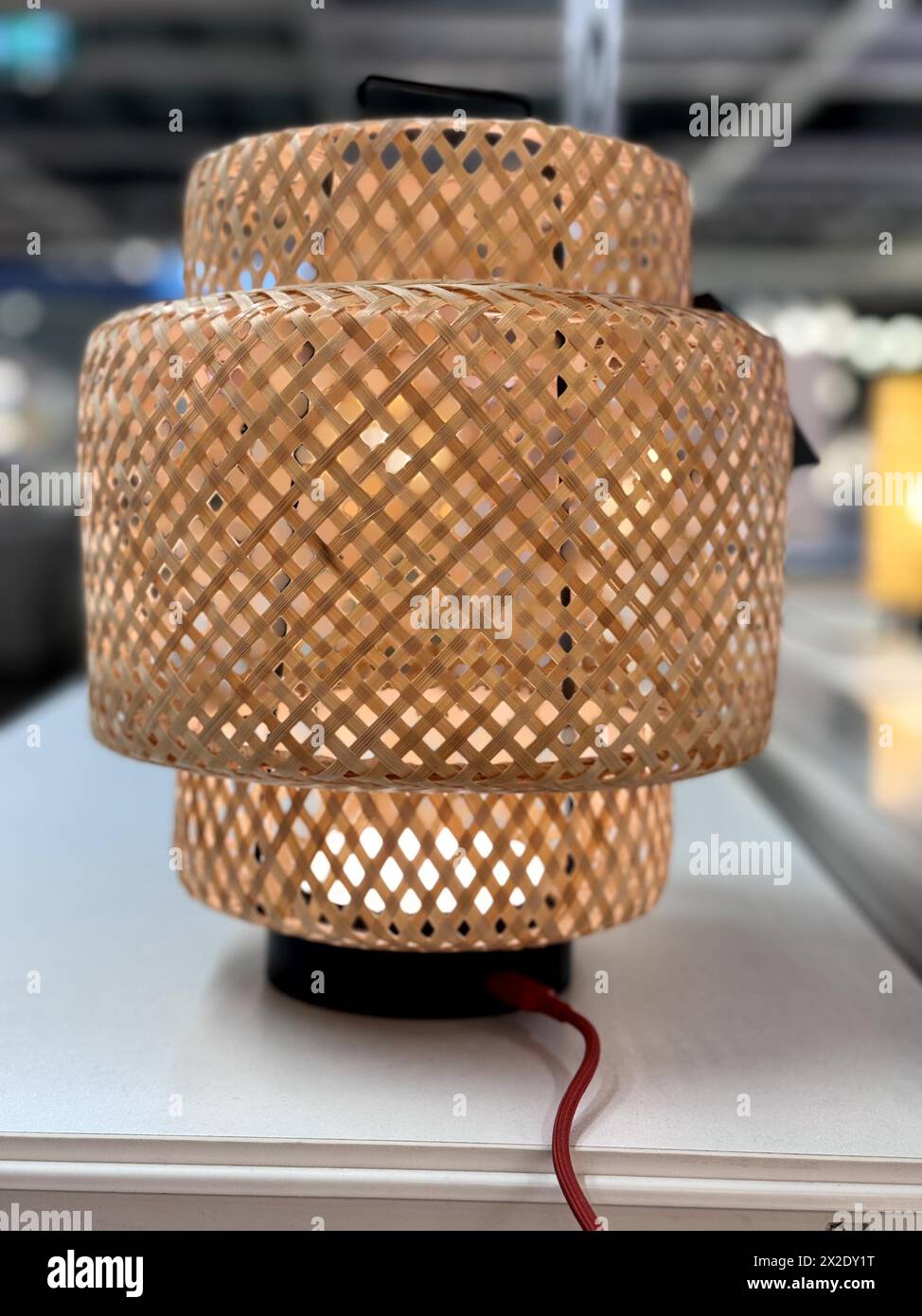 Vertical photo of a jute lamp. Lighted jute lamp with metallic black ...