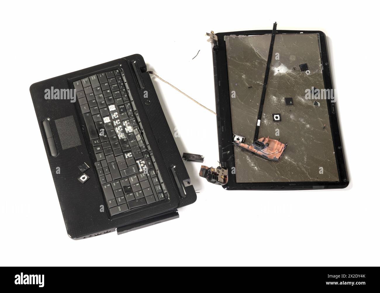 Old broken laptop isolated on white a background Stock Photo - Alamy