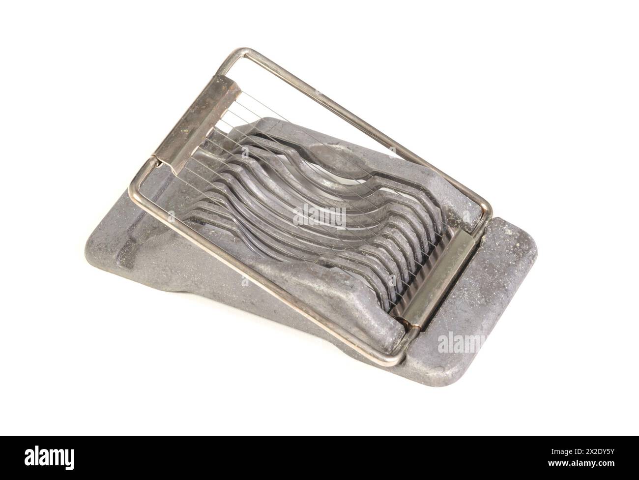 Very old egg cutter isolated on a solid background Stock Photo - Alamy