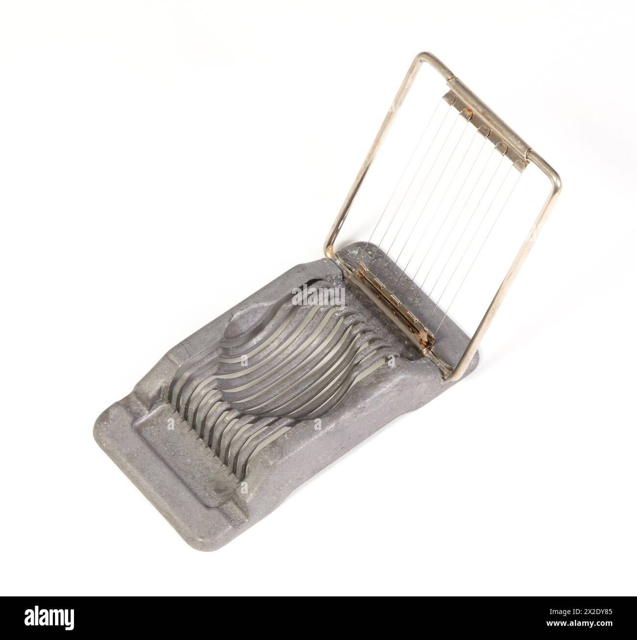 Very old egg cutter isolated on a solid background Stock Photo - Alamy