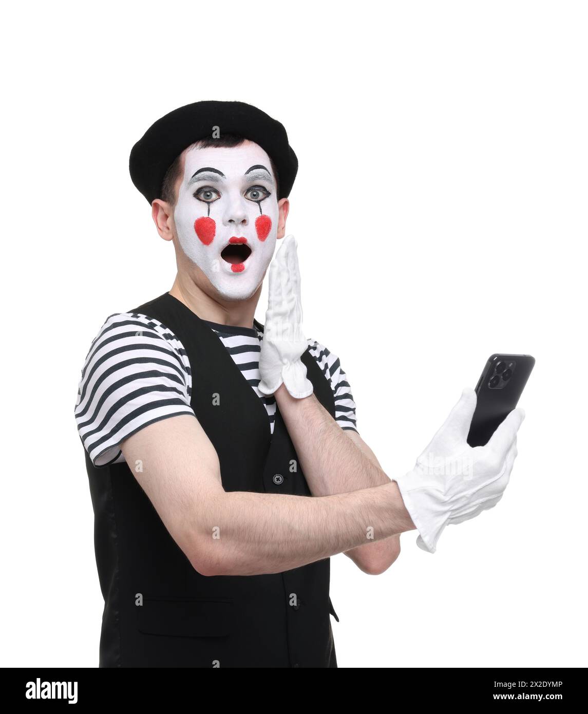 Mime artist with smartphone making shocked face on white background ...