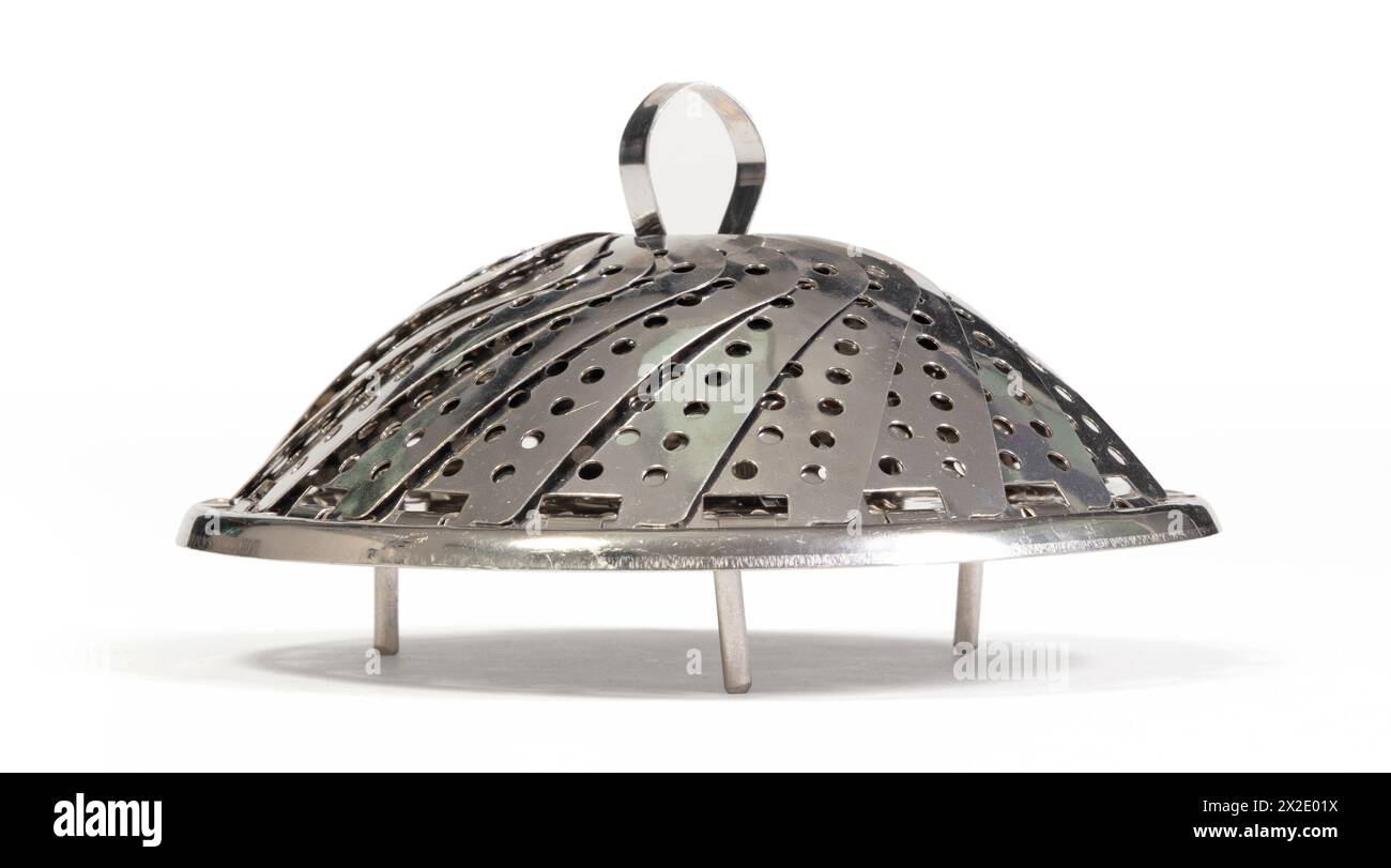 Old kitchen tool for boiling vegetables, place it in a pan with little ...