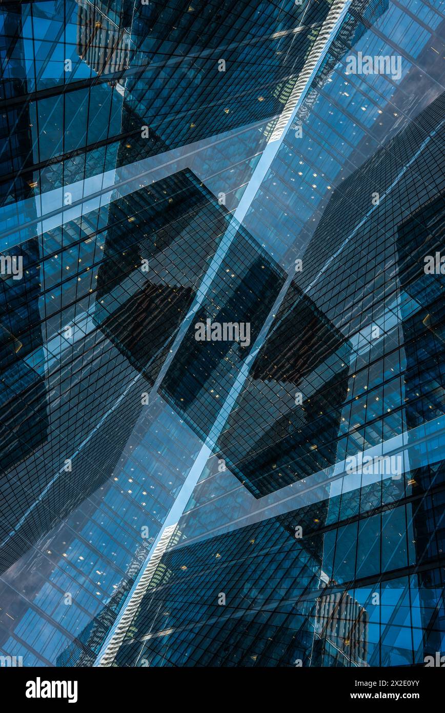 symmetry and mirrored geometry pattern, reflected skyscrapers and ...