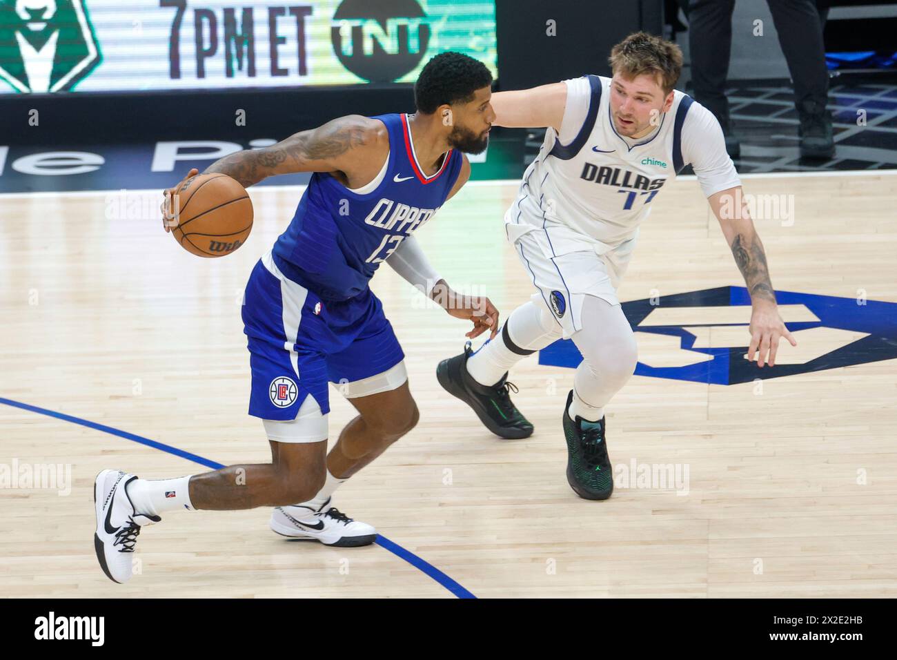 Los Angeles, USA. 21st Apr, 2024. Los Angeles Clippers' Paul George (L) is defended by Dallas ...