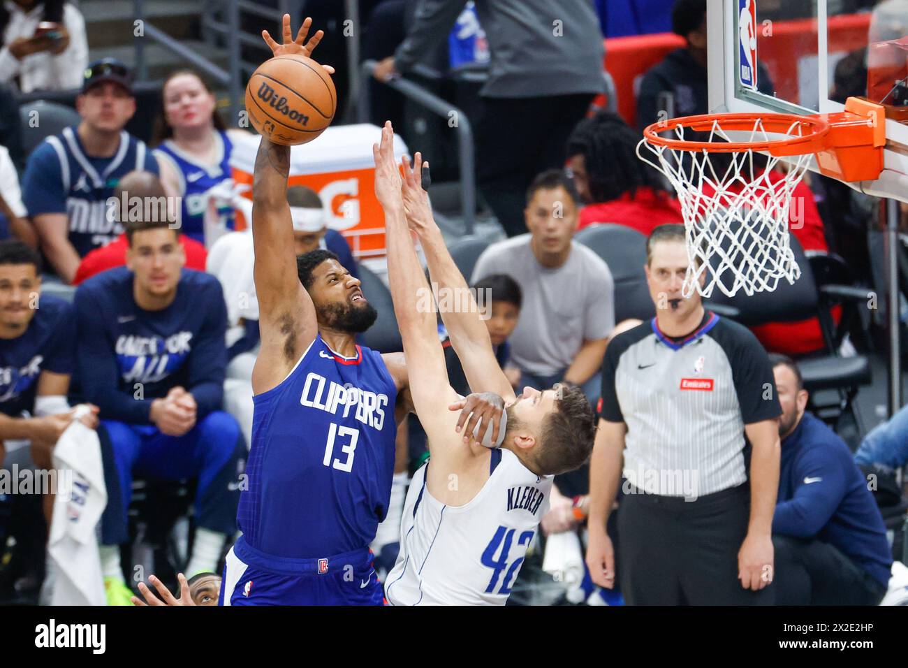 Los Angeles, USA. 21st Apr, 2024. Los Angeles Clippers' Paul George (L) goes up for a basket ...