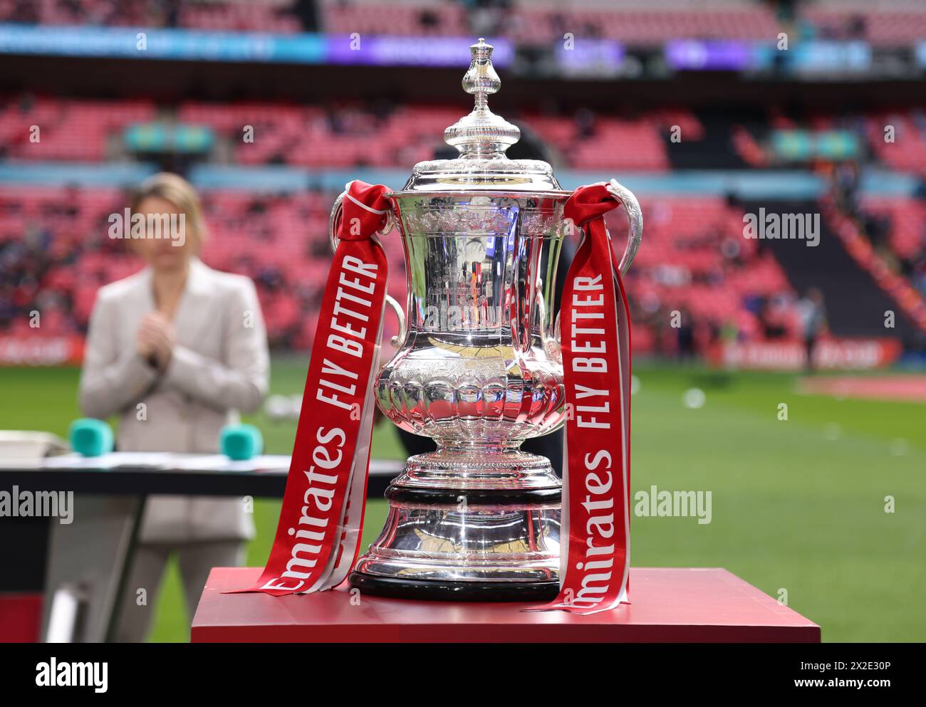 London, UK. 21st Apr, 2024. The FA Cup Trophy with ITV presenter Karen ...