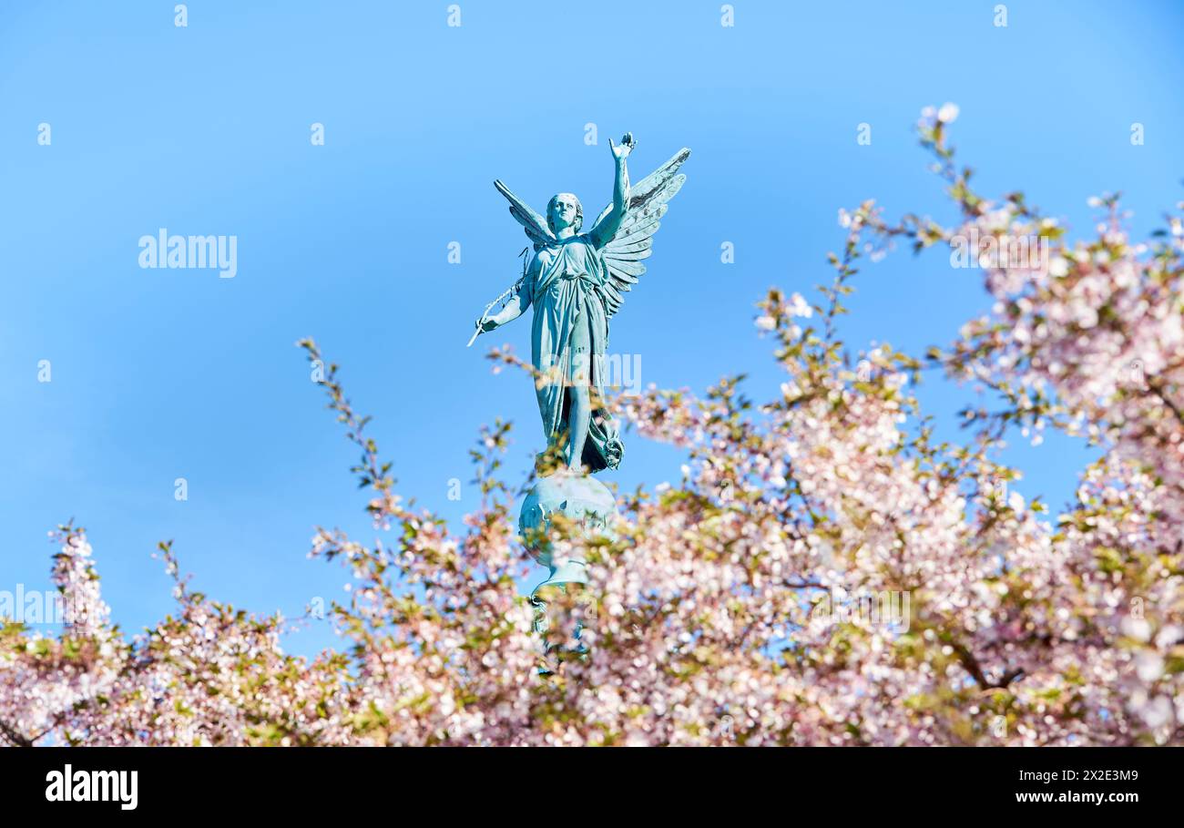 Angelic statue for the fallen in war saluting high on a column above ...