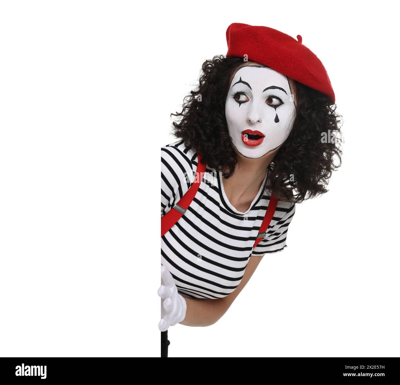 Funny mime with blank poster posing on white background Stock Photo - Alamy