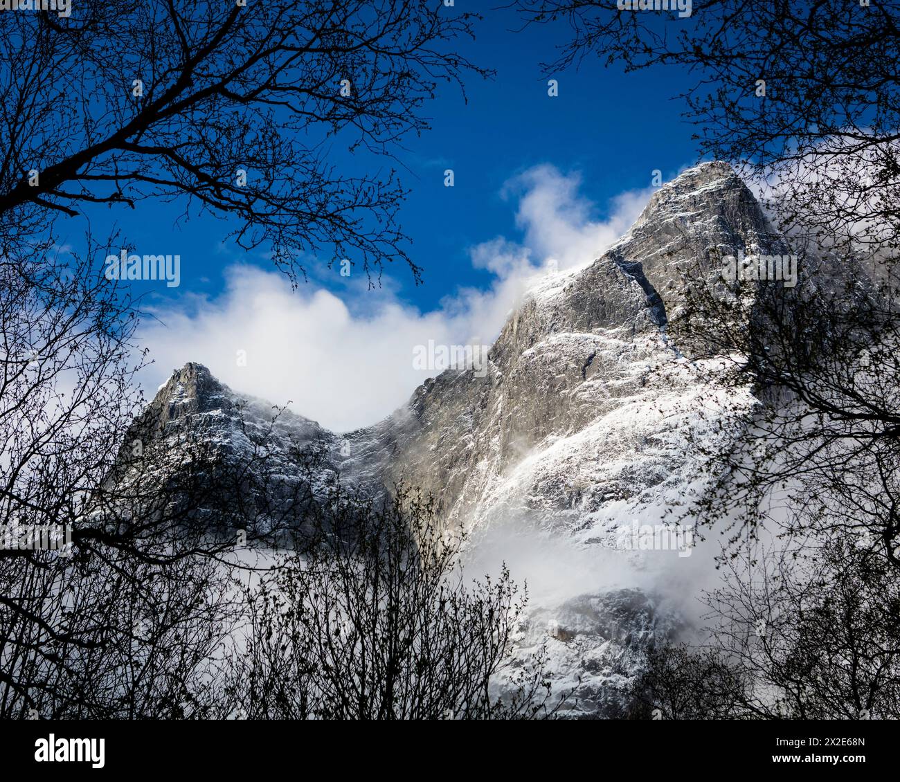 Mountain landscape with mist around the peaks Semletind (left) and ...