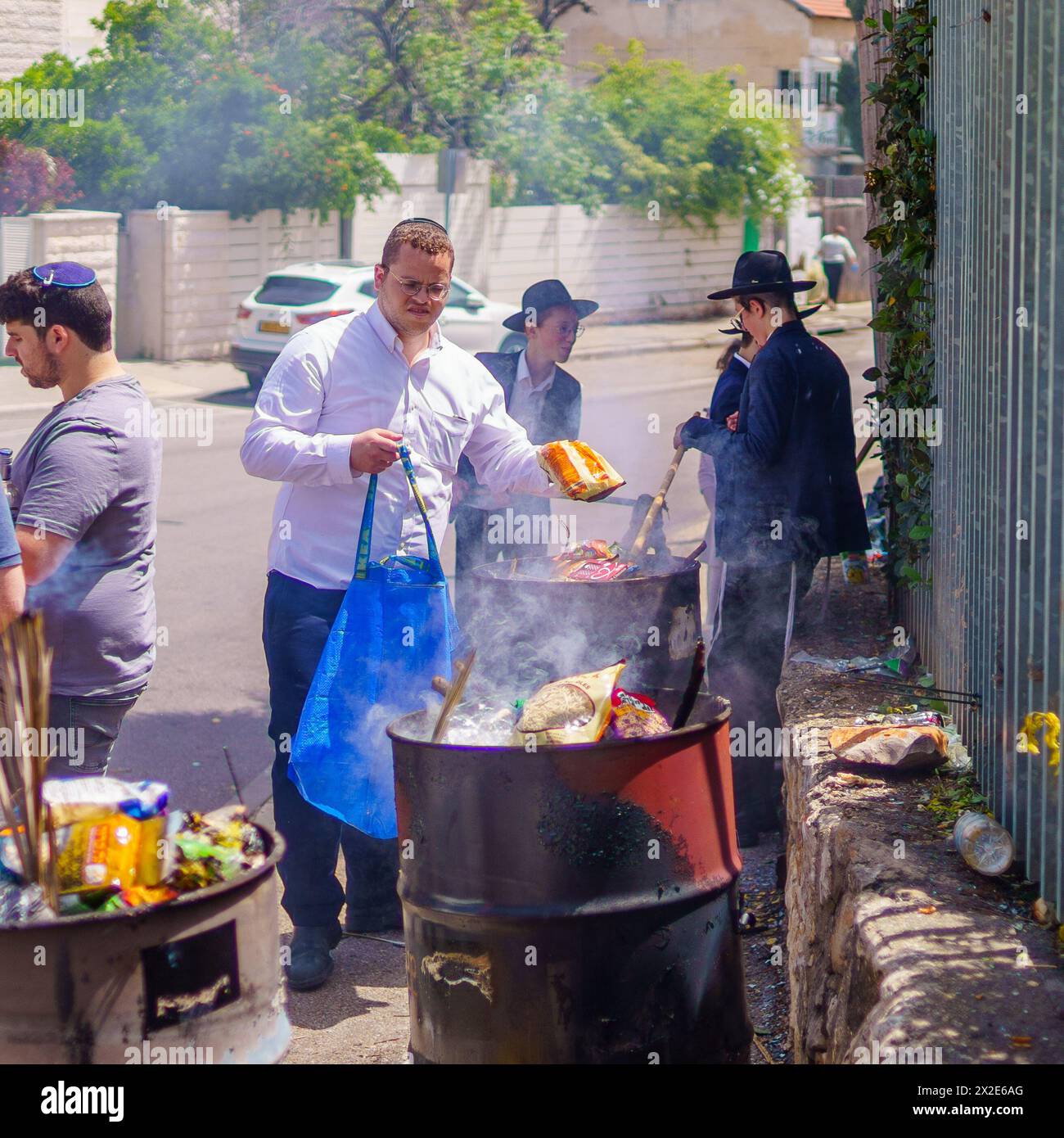 Haifa, Israel - April 22, 2024: Jewish men perform a Biur Chametz ...