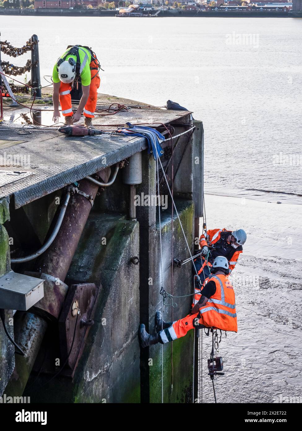 The image is of the Port of Liverpool construction workers working on ...
