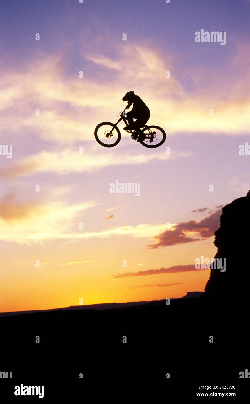Mountain biker making big jump Stock Photo - Alamy