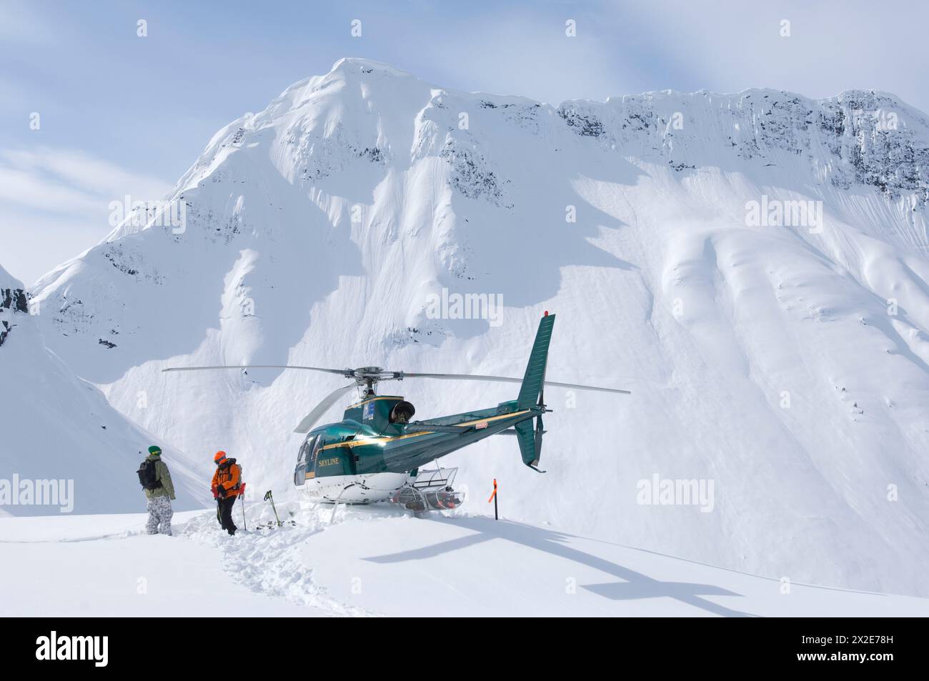 Men scoping a line next to the helicopter while filming with Matchstick ...