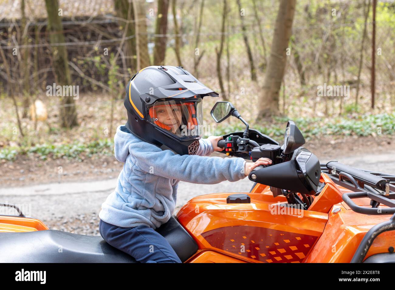 Children, riding on a buggy wheel with father, fast cars, wearing ...