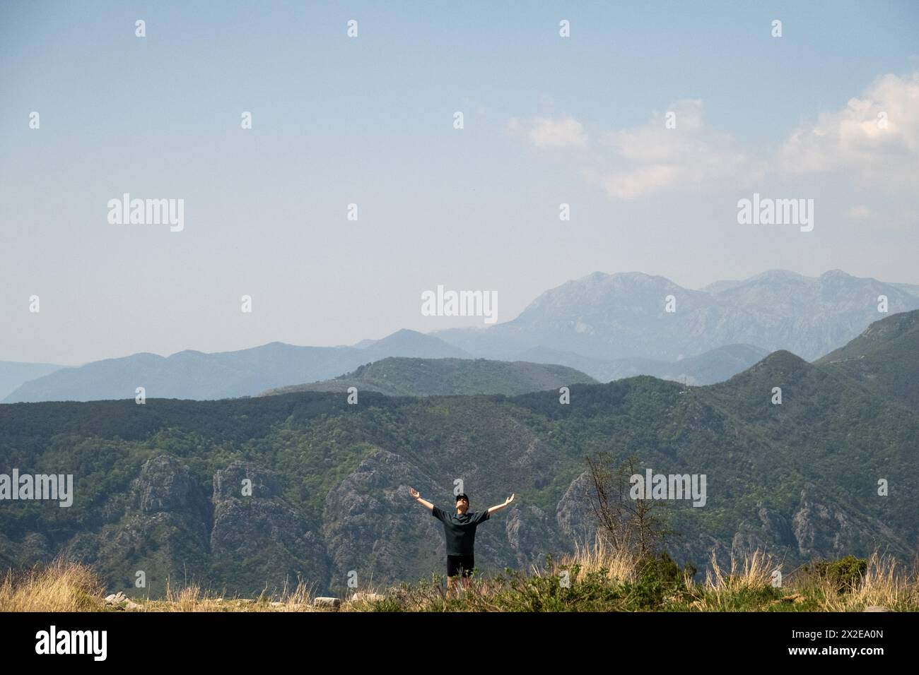 Expressing gratitude in nature at the top of a mountain in Kotor Stock ...