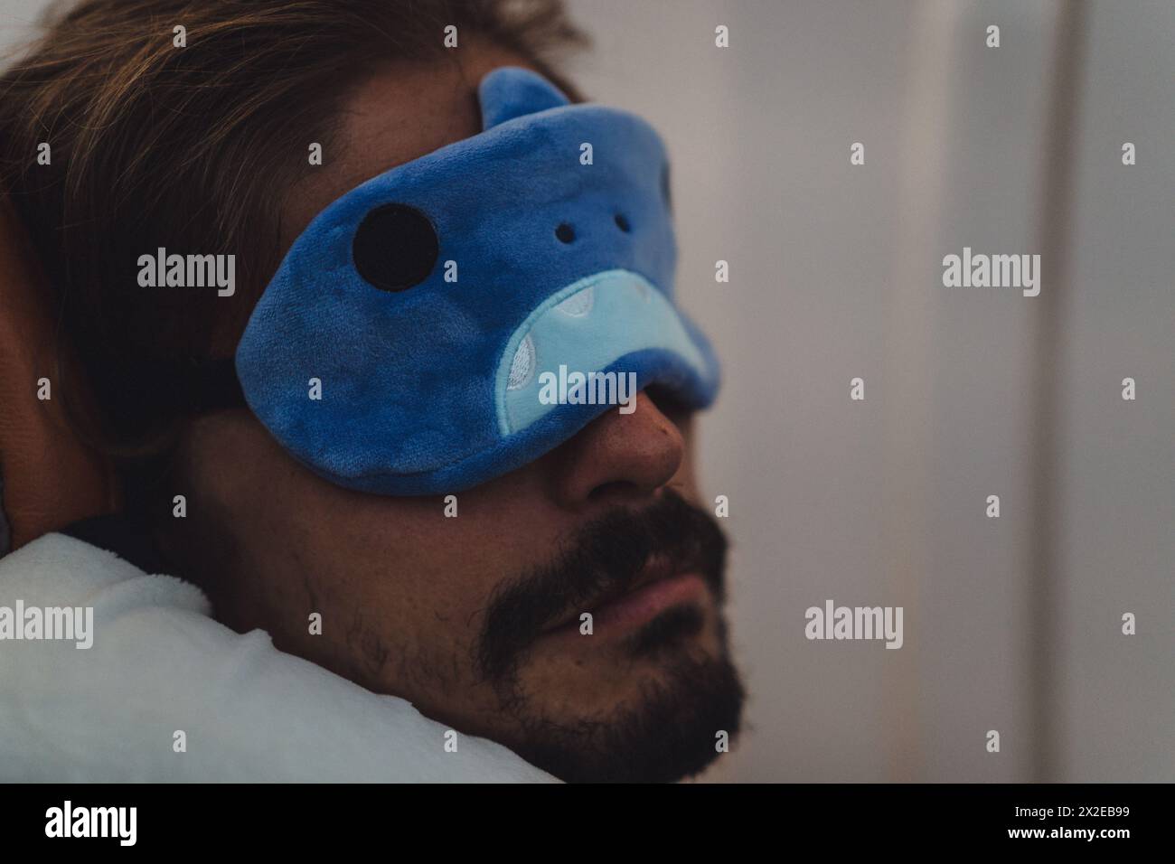 Man wearing headphones on plane hi-res stock photography and images - Alamy