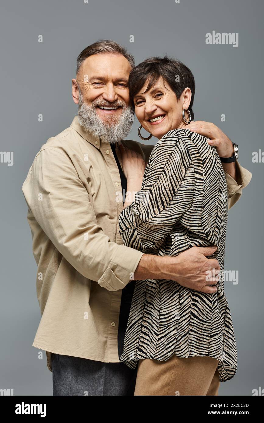 A middle aged couple in stylish attire sharing a warm, heartfelt hug in ...