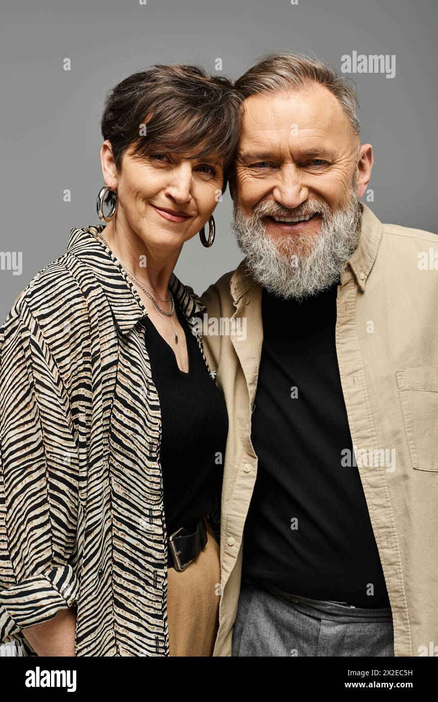 A Middle Aged Man And Woman Dressed In Elegant Attire Standing Next To