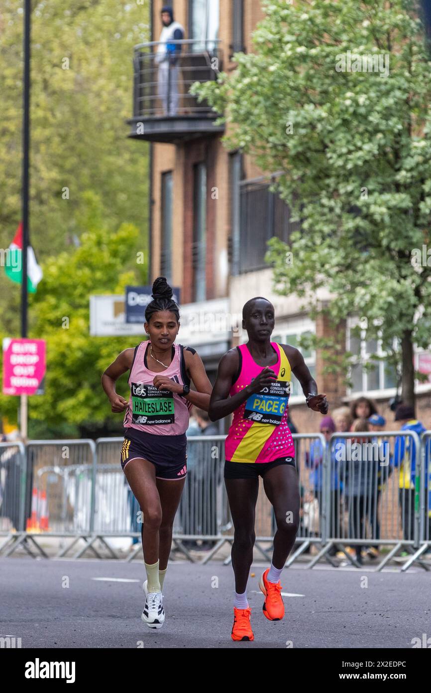 London, UK. 21st April, 2024. Tsige Haileslase (l) of Ethiopia competes ...
