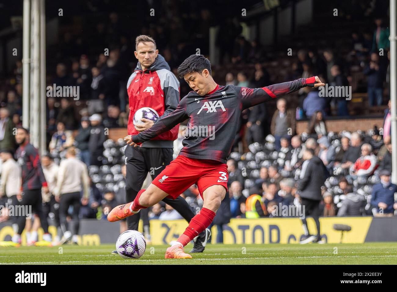 Liverpool player Wataru Endo warming up before the Premier League match ...