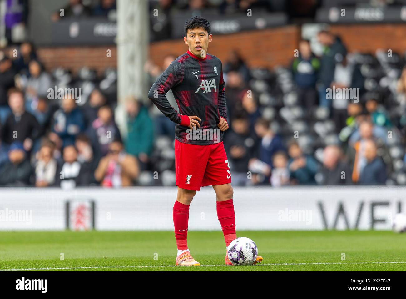Liverpool player Wataru Endo warming up before the Premier League match ...