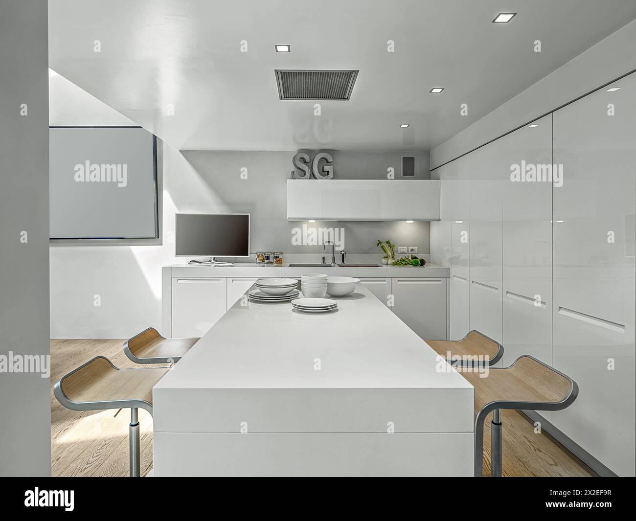 interior shots of a modern kitchen with kitchen island the floor is made of wood Stock Photo - Alamy
