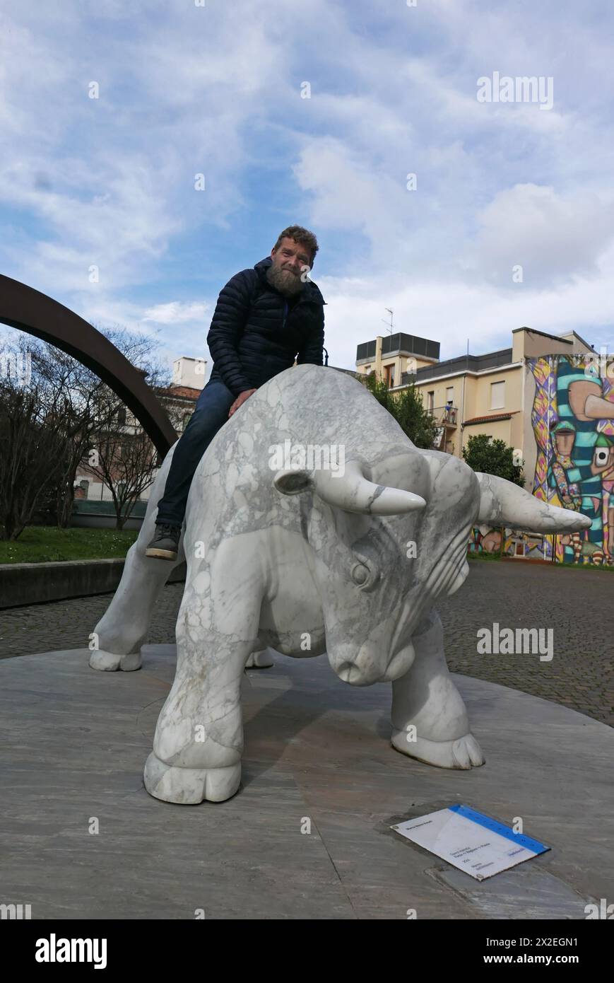 PADUA, ITALY- MARCH 3, 2024: Man riding the marble Bull created by the ...