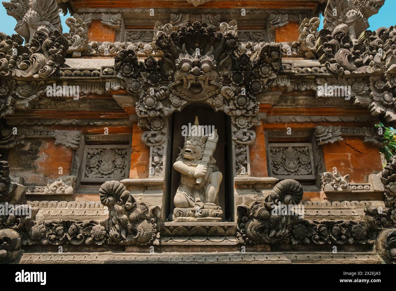 Balinese stone carving on a Hinduism temple and mythological figures ...