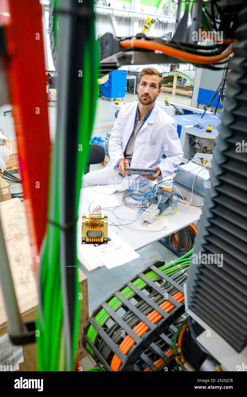 Robotic mobile platform for aeronautical drilling. Researcher working ...