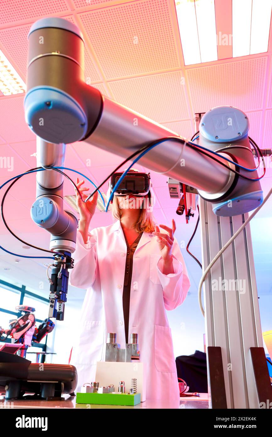 Robotic arm with artificial vision, Researcher with virtual reality glasses, VR, Humanoid robot ...