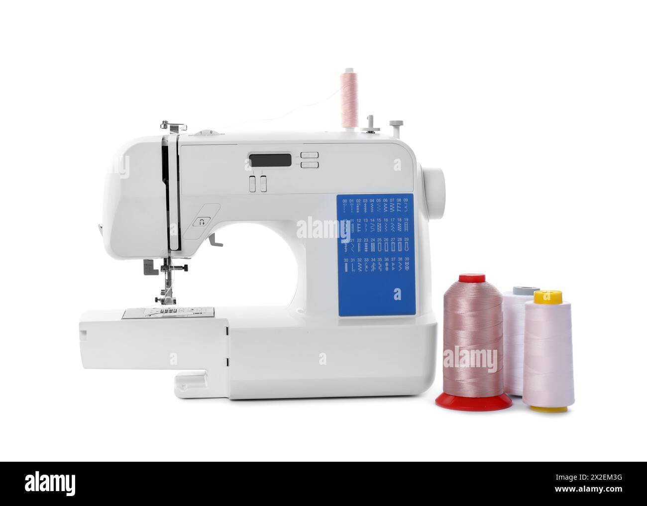 Sewing machine and spools of threads isolated on white Stock Photo - Alamy