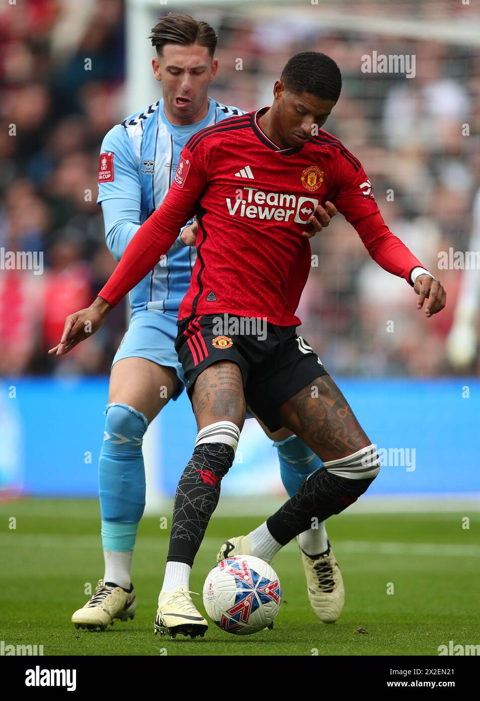 Marcus Rashford of Manchester United and Luis Binks of Coventry City ...
