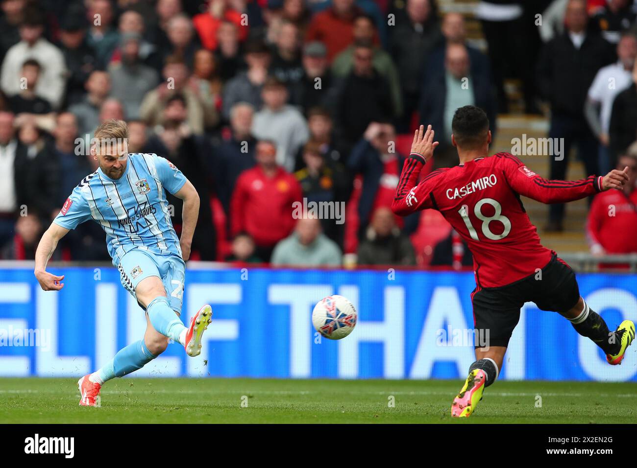 Matthew Godden of Coventry City shoots at goal as Casemiro of ...
