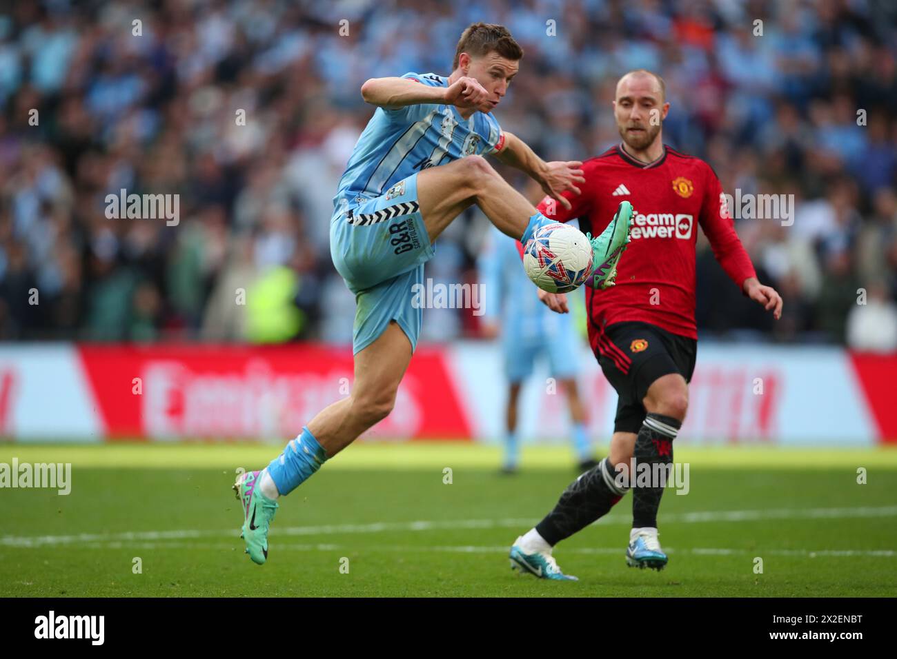 Ben Sheaf of Coventry City and Christian Eriksen of Manchester United ...