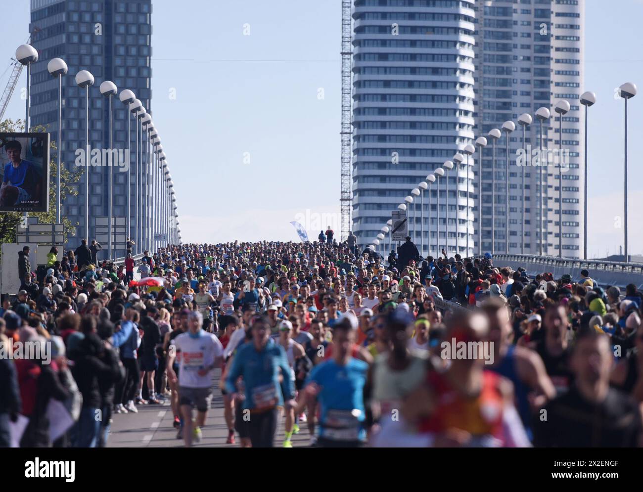 Vienna, Austria. 21st Apr, 2024. Participants run past the Reichsbrucke ...